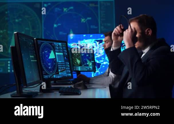 Workplace of the air traffic controllers in the control tower. Team of ...