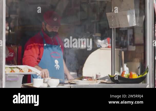Turkey, Istanbul-December, 2020: Man roasts street food. Action. Cook ...