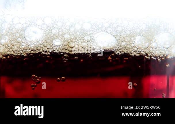 air bubbles in dense foam on the surface of an alcoholic beverage Stock ...