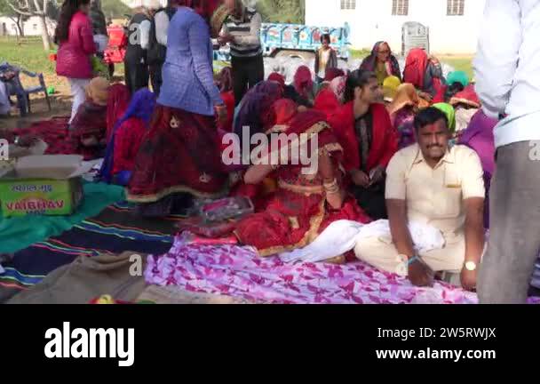 Two Indian family member offering Money or Dakshina in Hindu ...