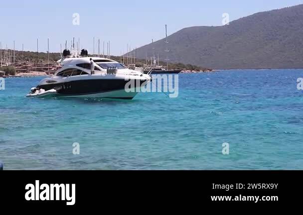 Luxury yacht cruising in the open sea. Speedboat cruising in the sea ...