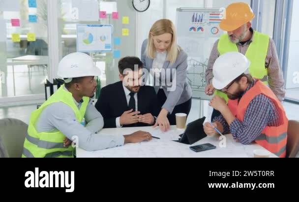 Portrait of good-looking high-skilled purposeful mixed races team of ...
