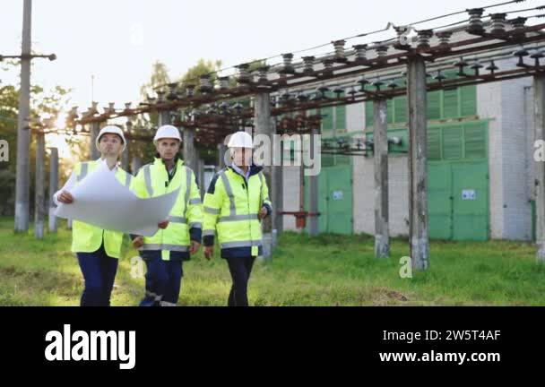Power specialists are planning a new project outdoors. Three engineers ...