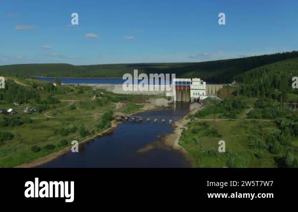 Hydroelectric dam with water flows through gates. spillway Stock Video ...