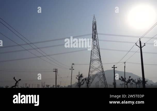 Energy transmission Tower with sunshine rays. Power lines with sunshine sky background. 4k high ...