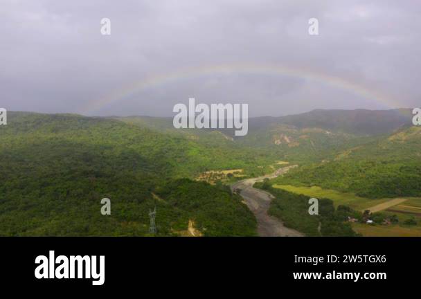 Rainbow in a mountain valley, after rain, top view Stock Video Footage ...