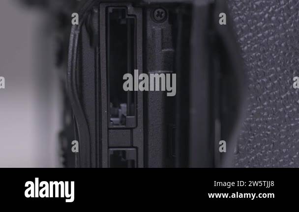 Extreme close up of an empty slot for SD memory card in the camera ...