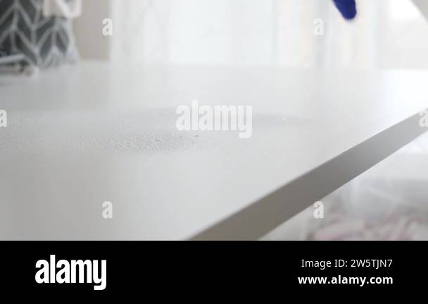 Cleaning home table sanitizing workplace table surface with ...