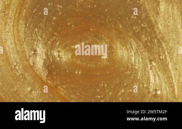 Liquid metallic gold background, texture. Sparkling yellow liquid paint ...