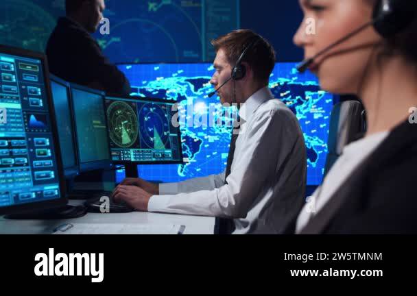 Workplace of the air traffic controllers in the control tower. Team of ...