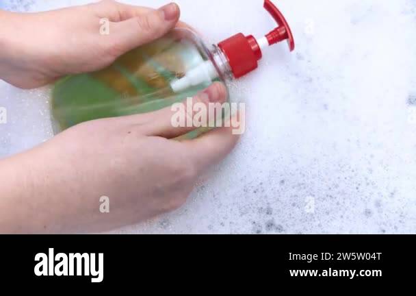 Bottles of detergents float in the foam. The concept of the dangers of ...