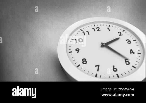 Animation of black and white clock moving fast on grey background. time ...