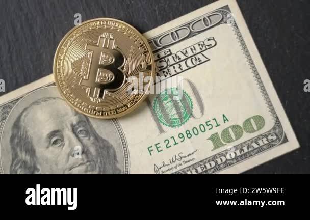 Bitcoin cryptocurrency equivalent to dollar, a banknote of one hundred ...