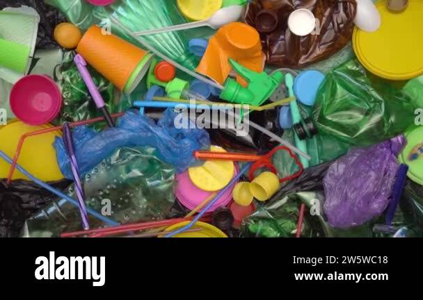 Environmental pollution by plastic waste. A pile of plastic garbage ...