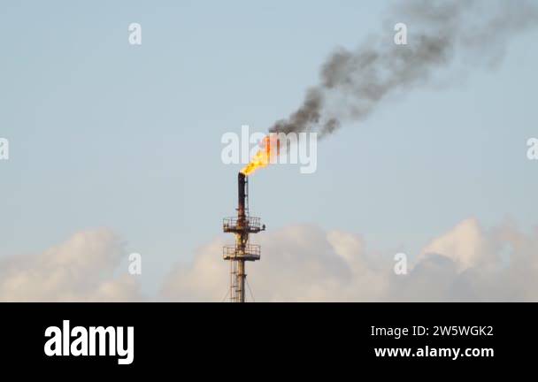 Fire on flare stack at refinery oil and gas central processing platform ...