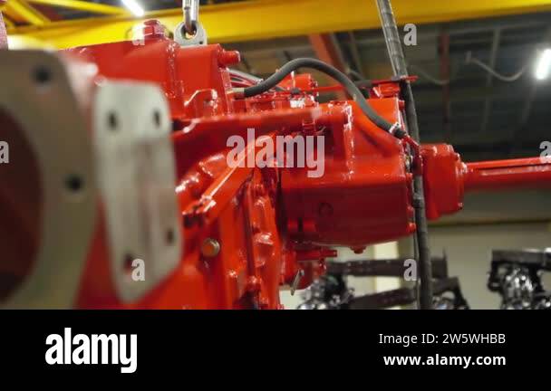 Moving the tractor engine around the shop on the crane beam, the engine ...