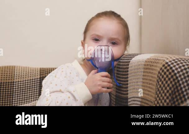 Treatment of a child at home for the flu and colds of the lungs. Kid ...
