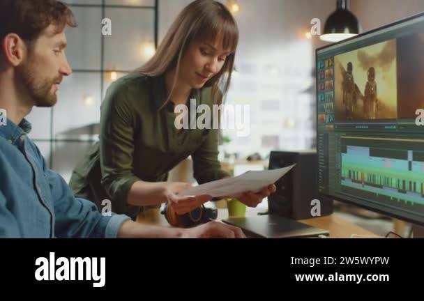 Beautiful Female Art Director Consults Handsome Video Editor Colleague ...