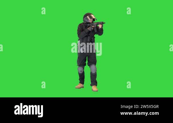 Police operator with assault rifle black uniforms aiming and shooting ...