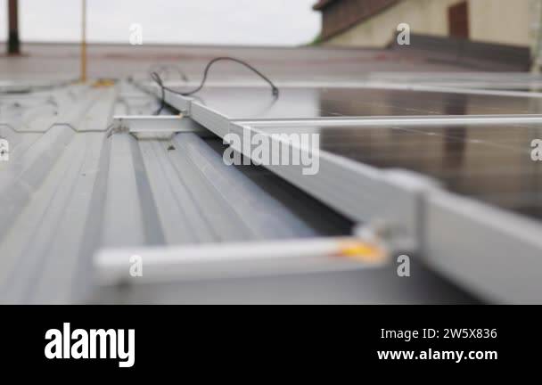 Close up of mounting solar panel, installing solar panels on house ...