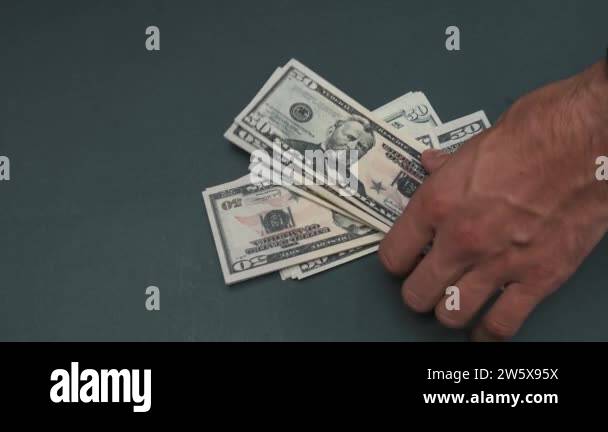 Greedy unrecognizable businessman hands grabbing lot of hundred dollar ... Greedy unrecognizable businessman hands grabbing lot of hundred dollar ...