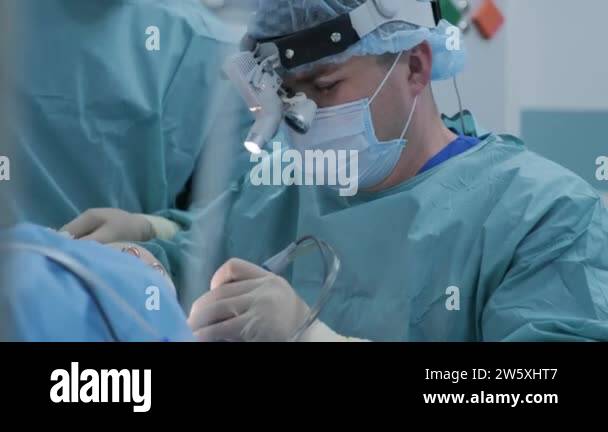 Operation of removing tonsils. tonsillectomy under deep anesthesia ...