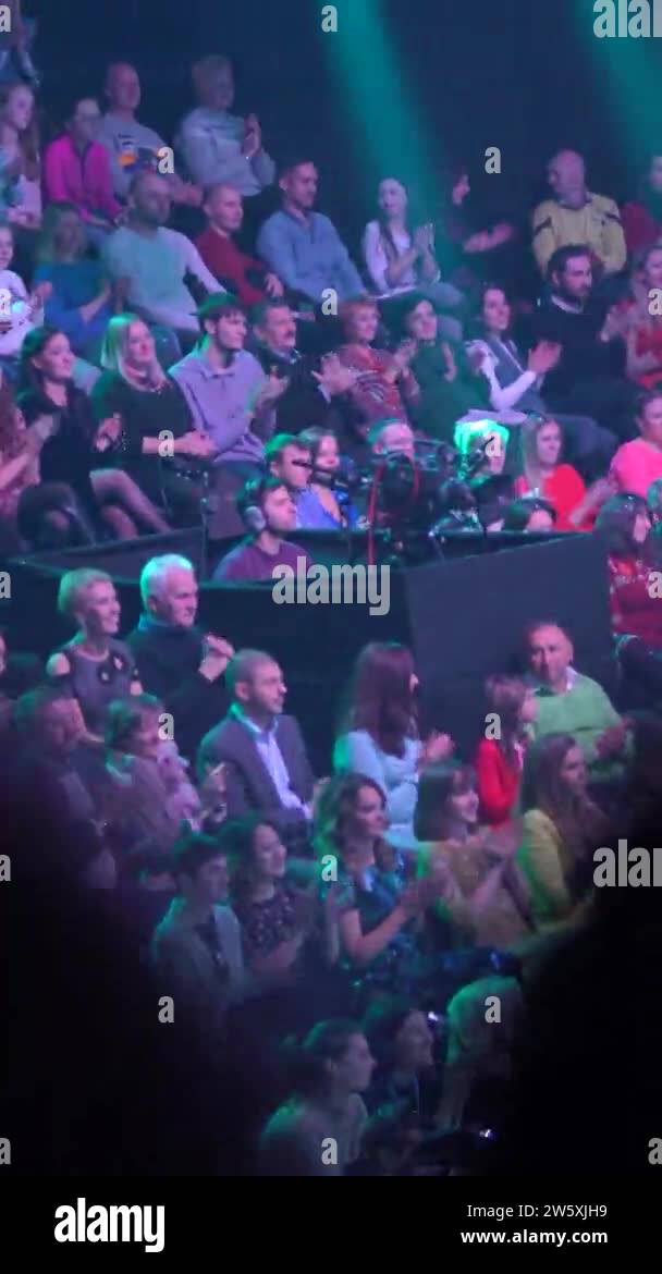 People viewers in a TV studio while recording a TV show. Vertical video ...