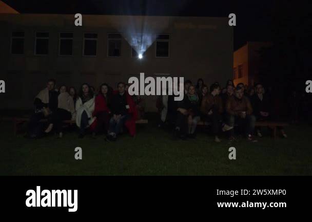 young people watch open air screening cinema movie. 4K Stock Video ...