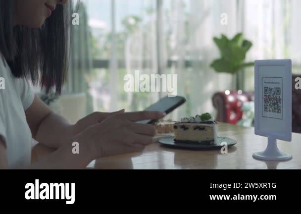 Beautiful woman scan barcodes for order. Women using their mobile ...