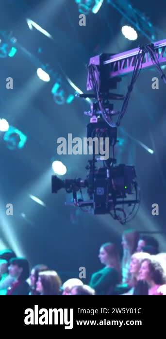 People viewers in a TV studio while recording a TV show. Vertical video ...
