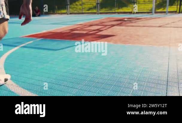 Close up of Caucasian active basketball male player practicing ball ...