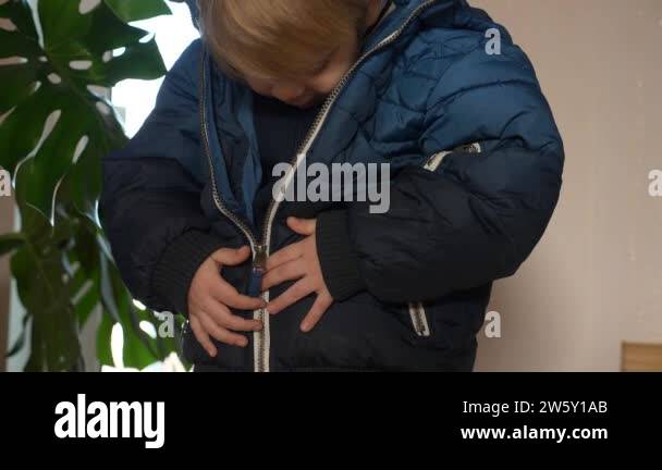 Cute Child Zipping his own Jacket. Little Boy Wearing Winter Attire. 2x ...
