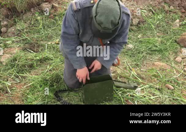 The soldier puts machine-gun tape in a drawer. The first world war. WWI ...