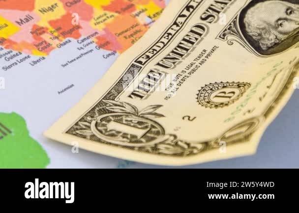 US dollar banknotes on globe world map, American investment and trading ...