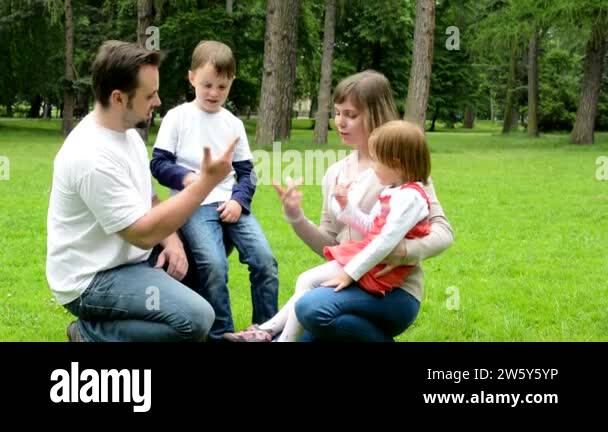 parents (mother and father) teach children (boy and girl) to count on ...