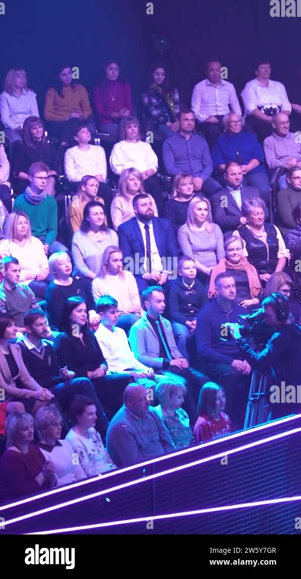 People viewers in a TV studio while recording a TV show. Vertical video ...