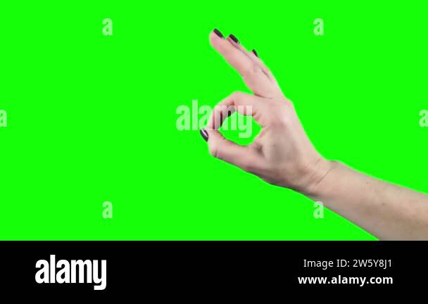 Female Caucasian hand showing OK on greenscreen. Finger gestures on ...