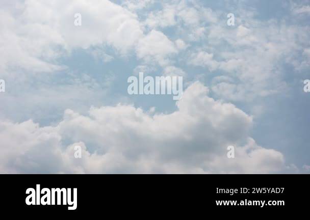 Building motions clouds with sky. Puffy fluffy white clouds sky time lapse. slow moving clouds ...