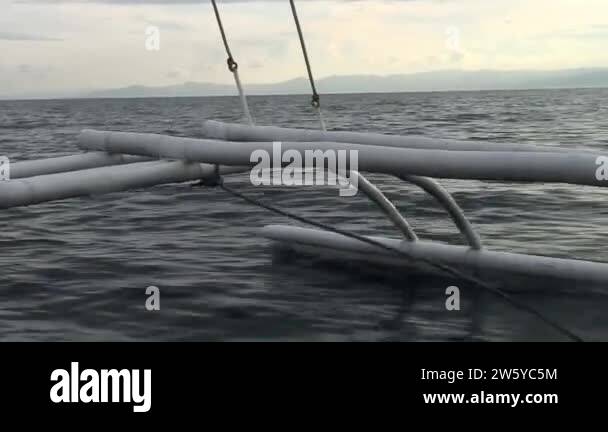Bamboo wings of philippine boat on background of sea on Philippines ...
