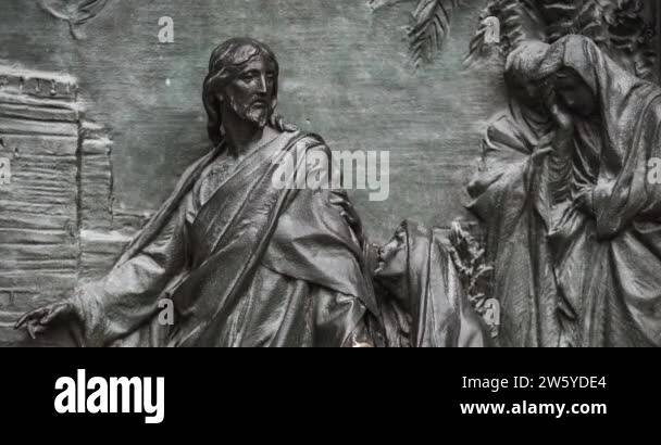 Statues of crusified Jesus and two criminal bandits filmed in close up ...