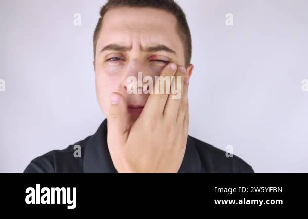 A man stands in front of a mirror and sees inflammation of the upper ...