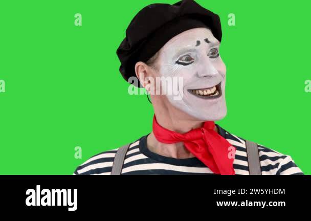 Mime artist smiling to camera being extremely happy on a Green Screen ...