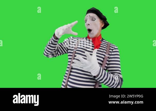 Mime character with imaginary ball on a Green Screen, Chroma Key Stock ...
