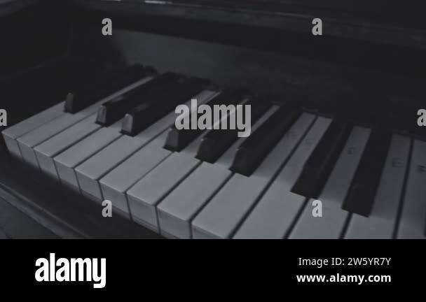 old vintage grand piano in black and white. monochrome details of ...