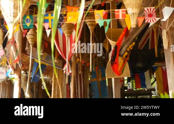 Decorative national flags of different countries hanging on strings in ...
