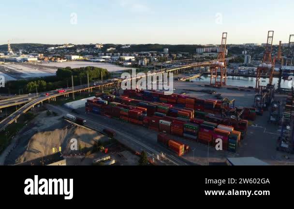 Aerial view of modern container port docks at sunrise. Harbor and ...