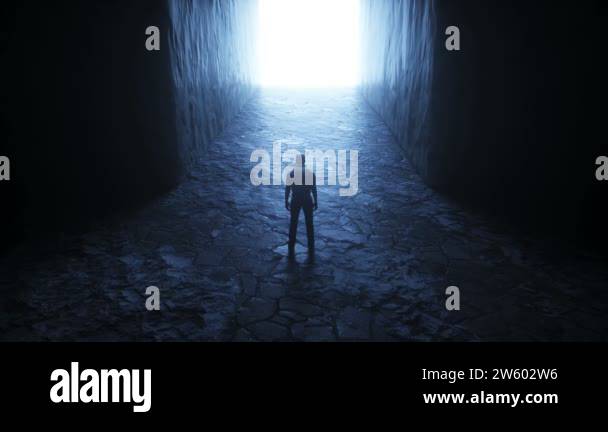 a lonely man stands in front of a light portal. Realistic 4k animation ...