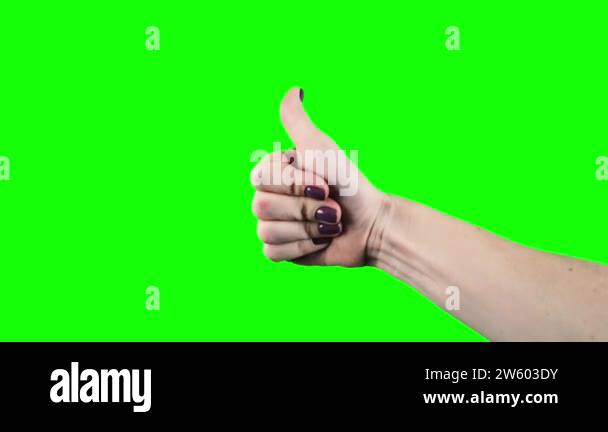 Female hand showing thumbs up on green screen. Finger gestures on ...