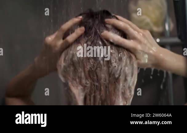 Rare footage of a woman rinsing her hair after shampoo in the shower ...