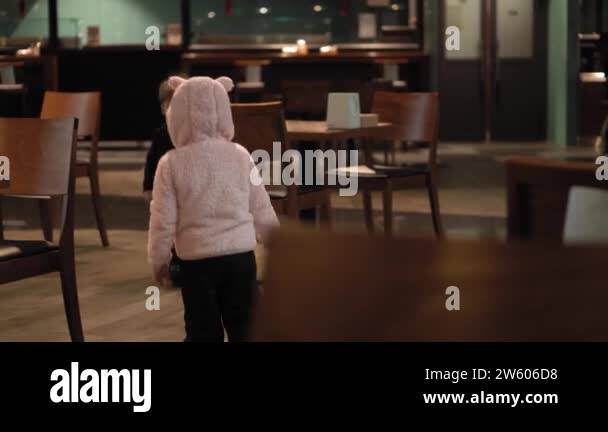 Authentic cheerful little preschool two kids 2-4 years runs around the ...
